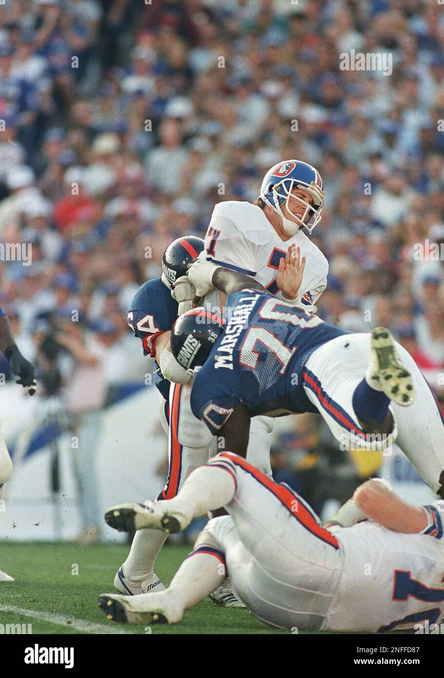 Denver Broncos quarterback John Elway gets pressure from New York ...