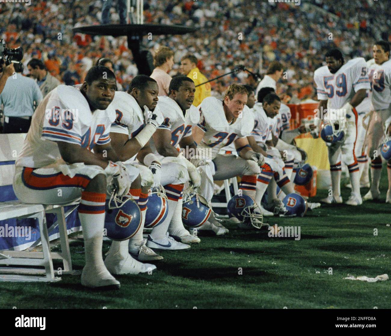 Members of the Denver Broncos, from left, Orson Mobley, Freddie Gilbert ...