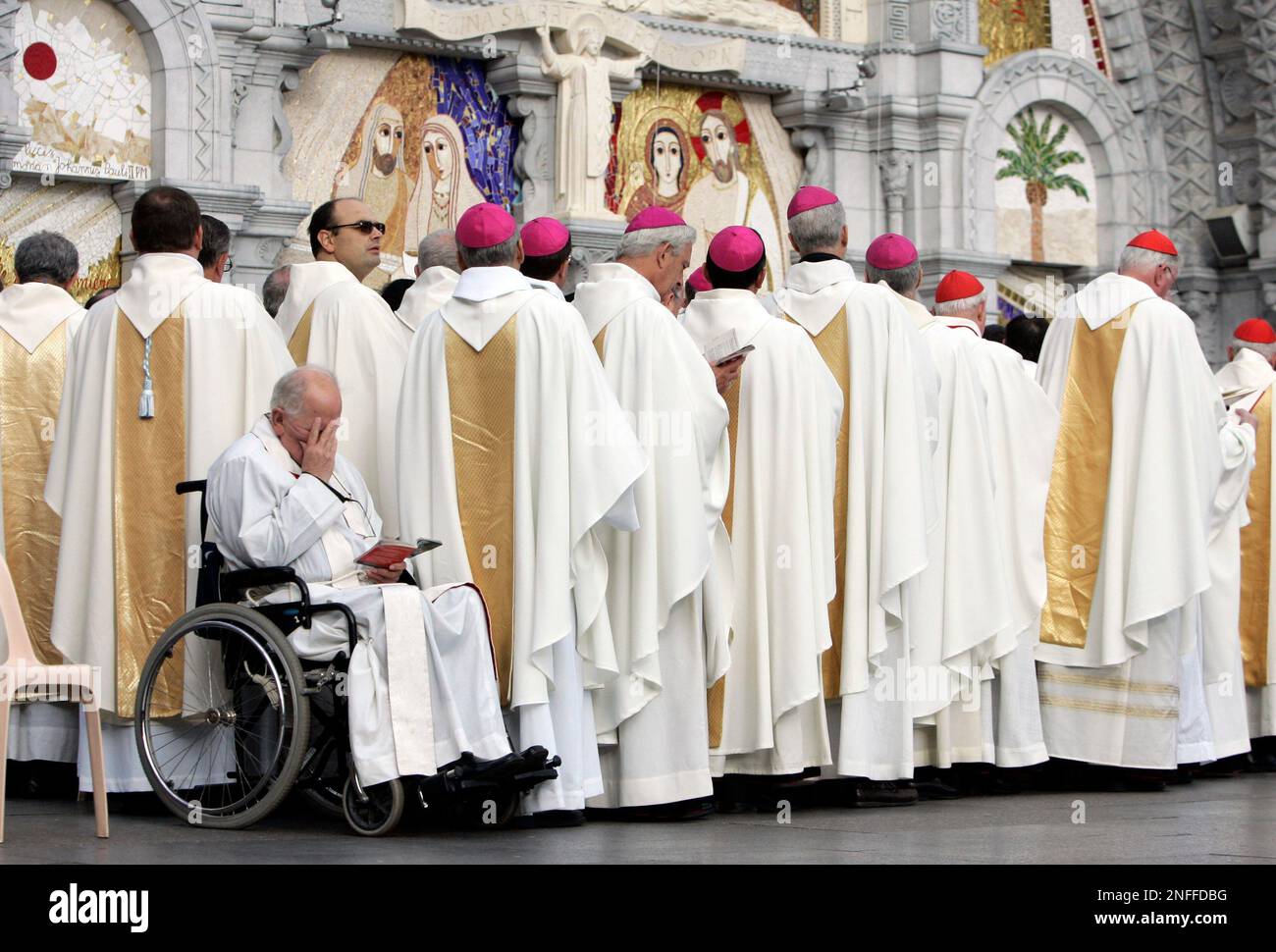 Cardinals and bishop pray as Pope Benedict XVI, unseen, celebrates a ...