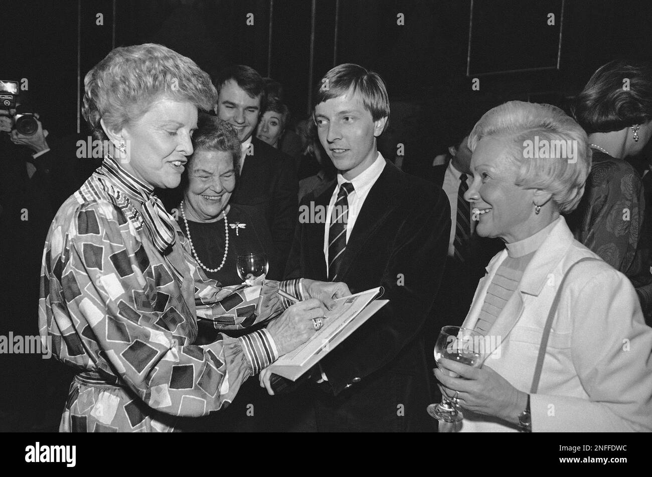 Former first lady Betty Ford, left, signs an autograph for a guest at a ...