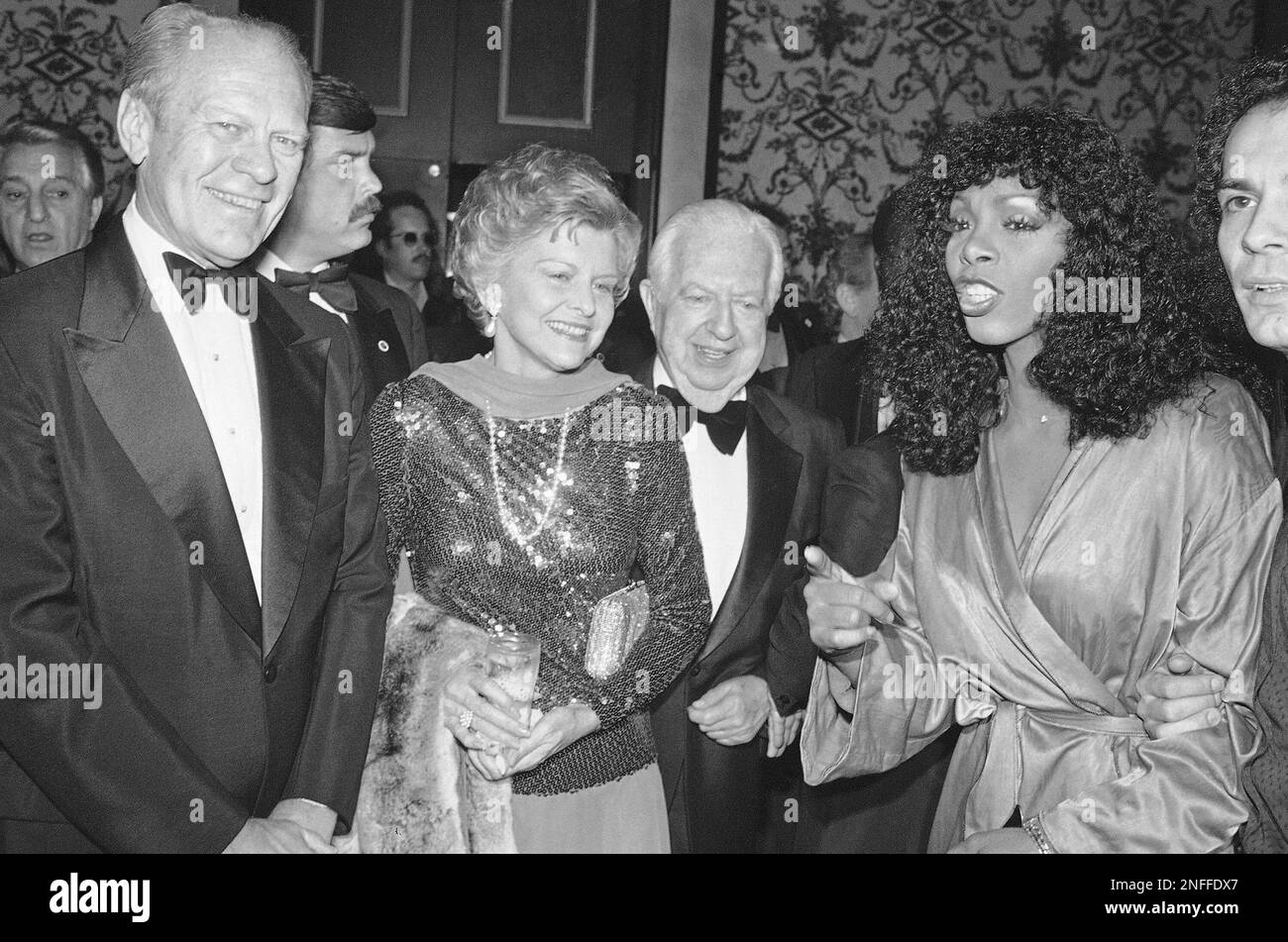 Gerald and Betty Ford, left, greet disco star Donna Summer, right, and ...