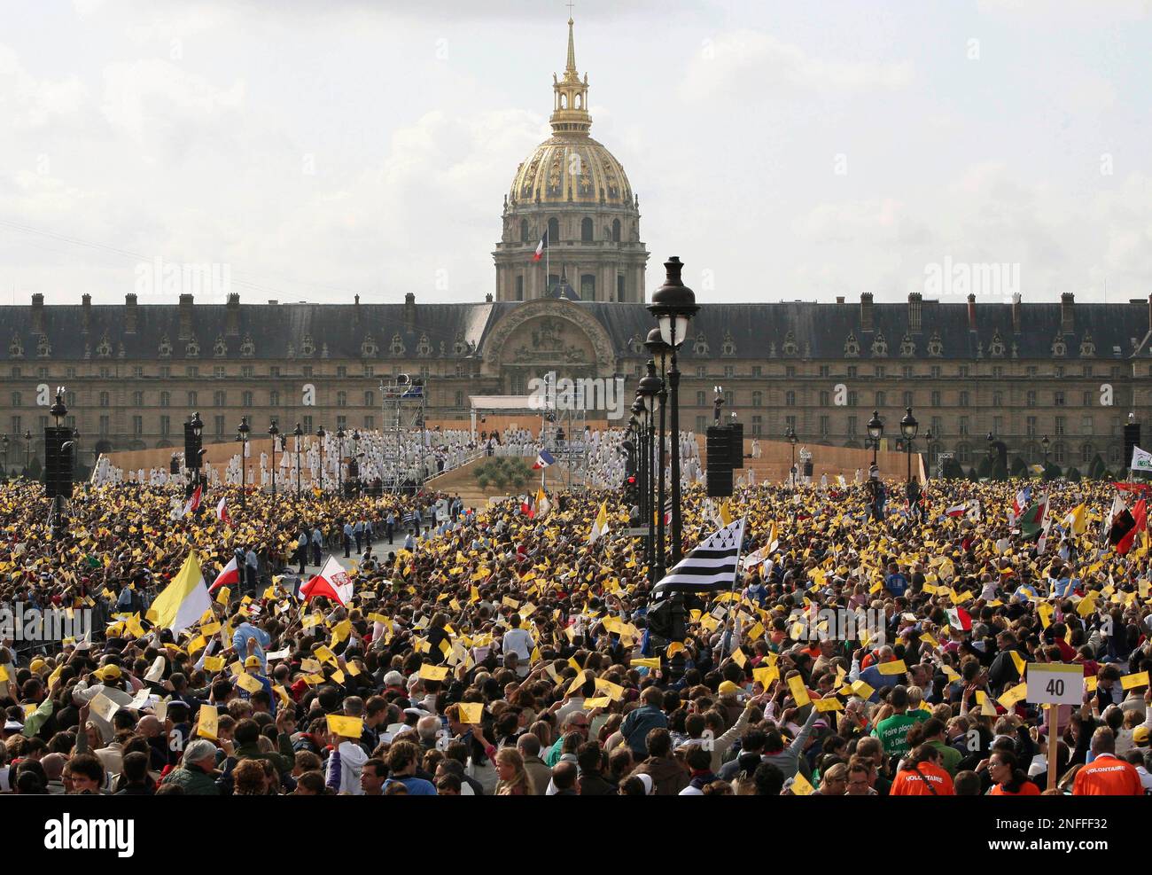 A crowd of faithful attend an outdoors mass celebrated by Pope Benedict ...