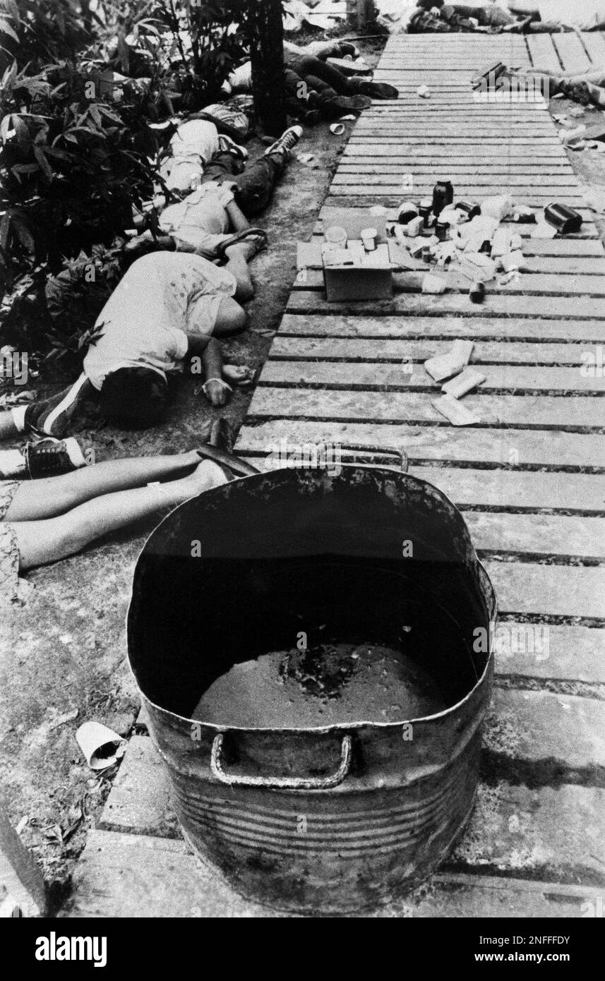 The vat of death sits on a sidewalk at Peoples Temple with bodies of ...