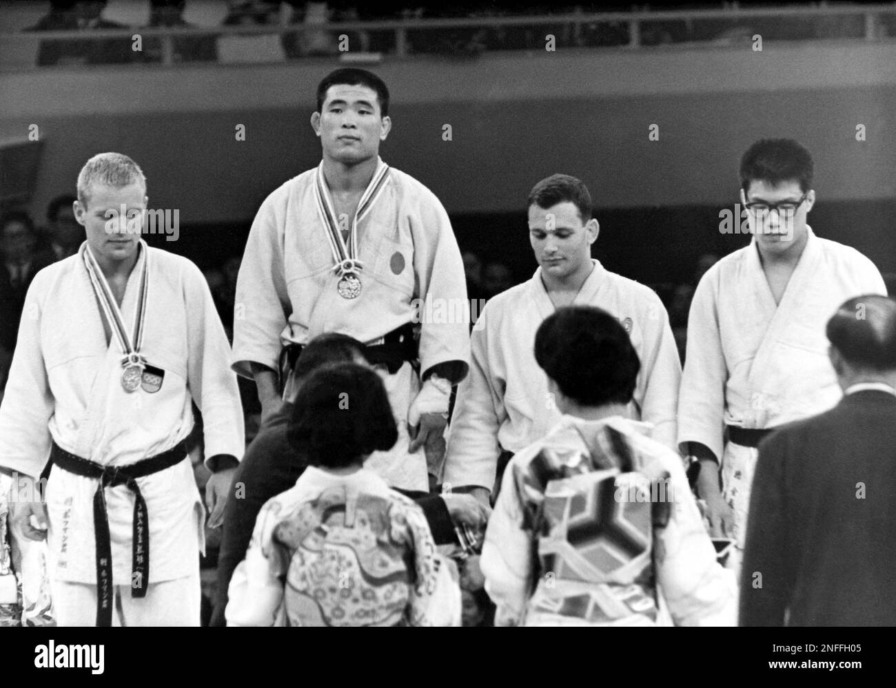 Winners of Olympic Judo middleweight class stand on victory stand at ...
