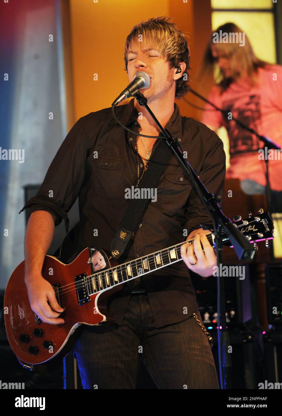 Rascal Flatts' Joe Don Rooney performs with his band after announcing ...