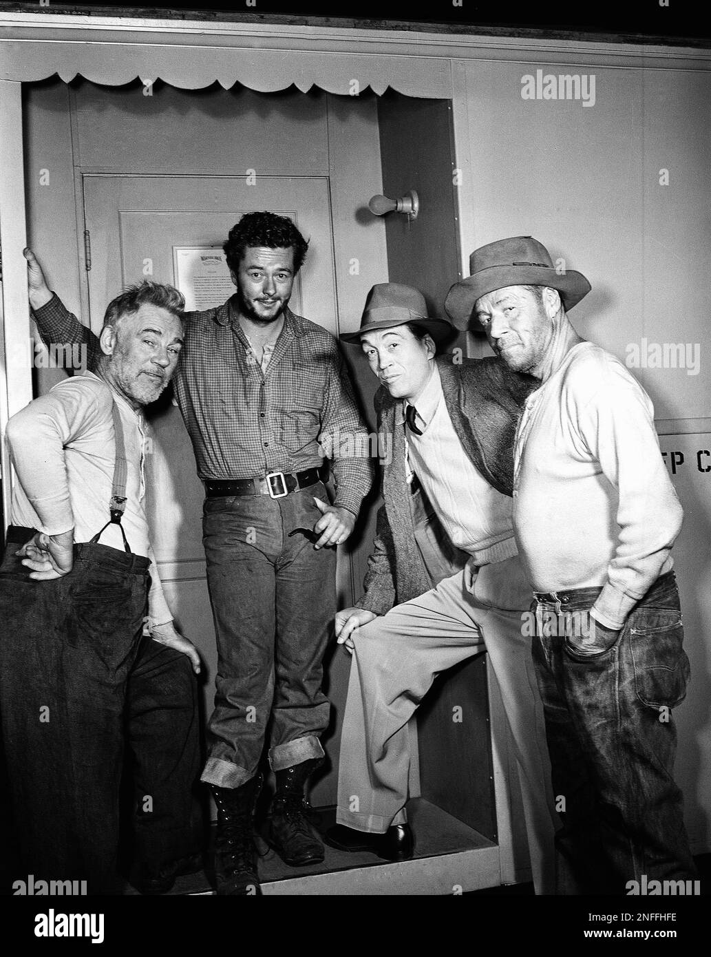 On the set of "Treasure of the Sierra Madre," two sons pose with their ...