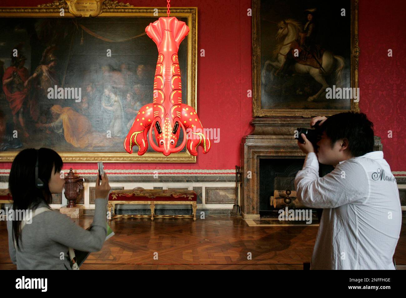 Visitors picture "Lobster", by artist Jeff Koons of the United States ...