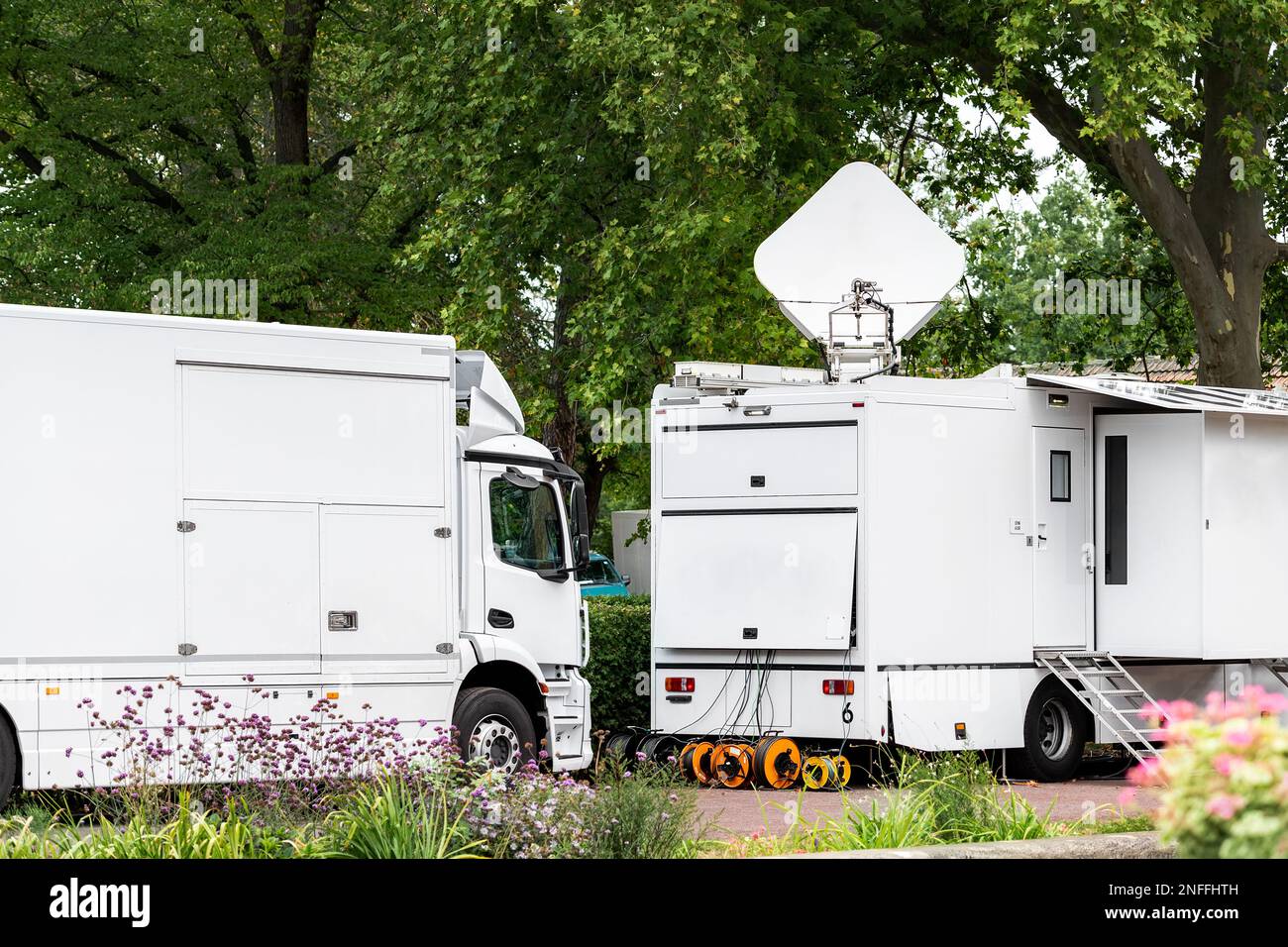 Many modern white mobile digital electric tv broadcasting trucks ...