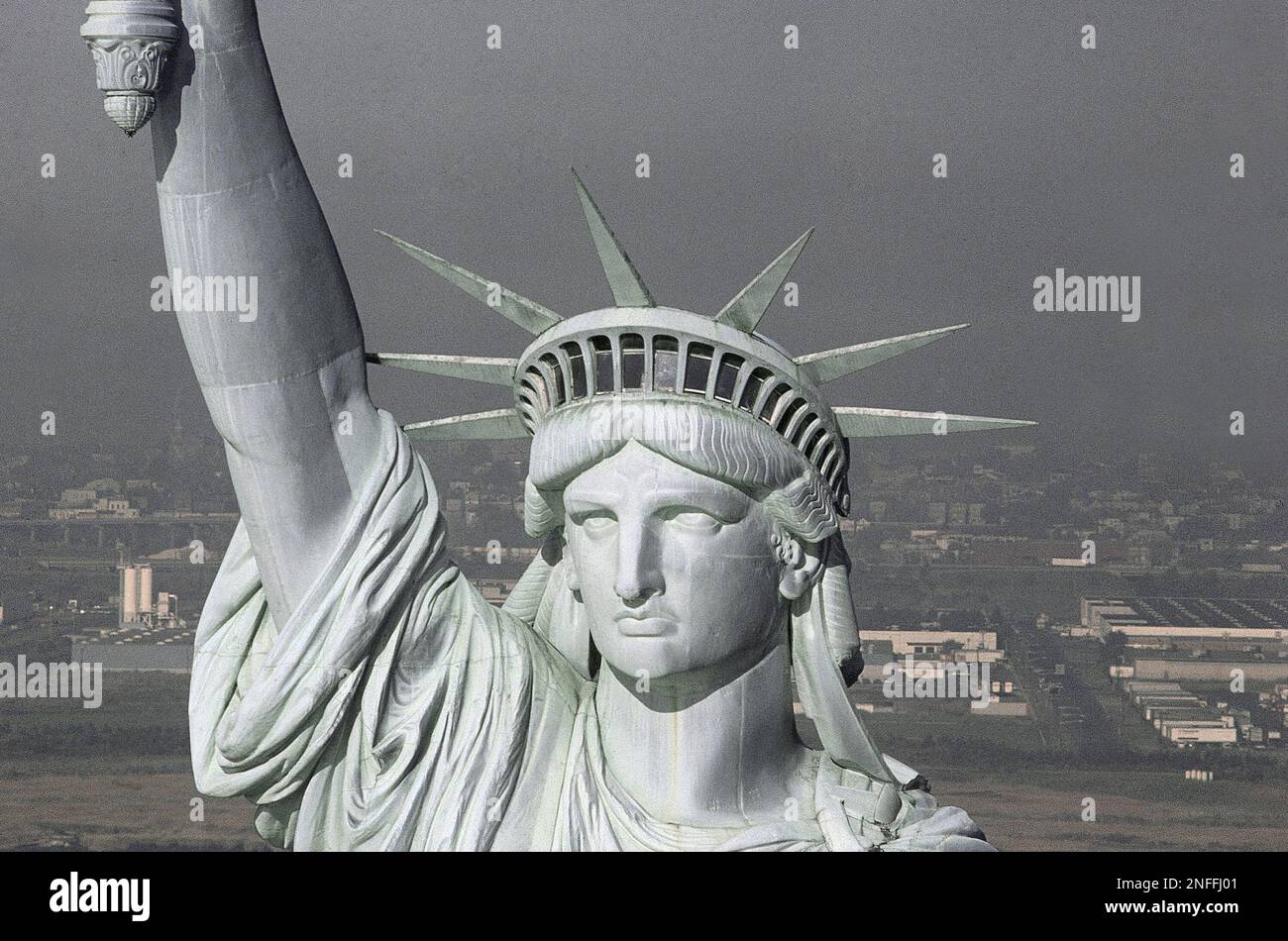 A 1983 aerial view of the Statue of Liberty in New York Harbor, showing ...