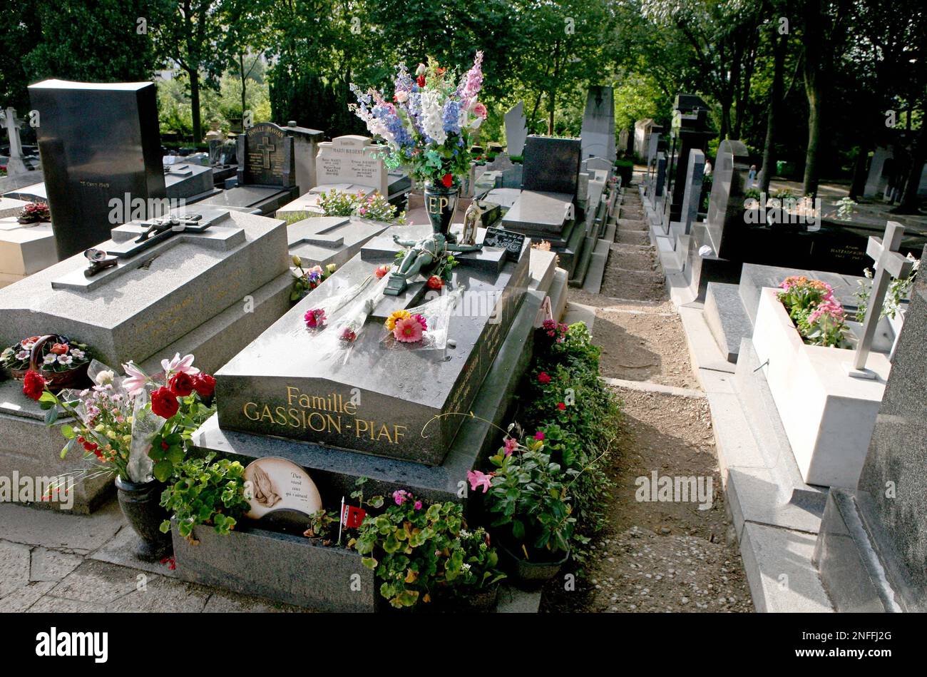 Edith Piaf's grave is seen in the Pere Lachaise cemetery in Paris ...
