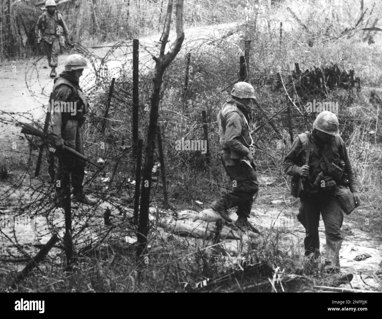 United States Marines patrol the perimeter of their outpost at Khe Sanh ...