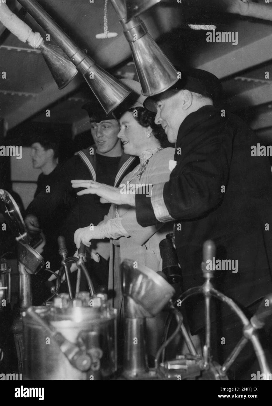 Queen Elizabeth, is flanked by Arthur Campbell, quartermaster, left and ...
