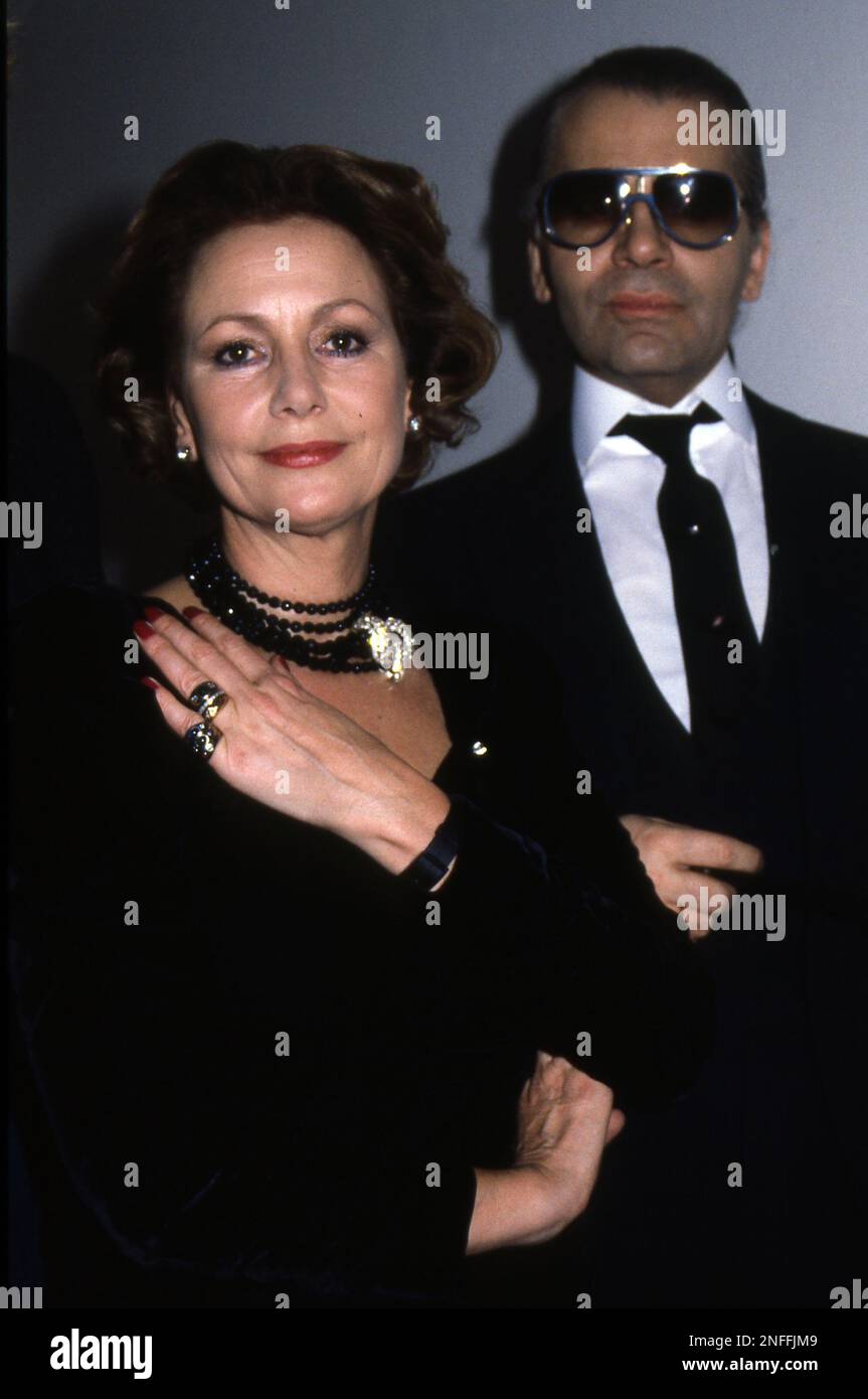 West German fashion designer Karl Lagerfeld poses next to actress and ...