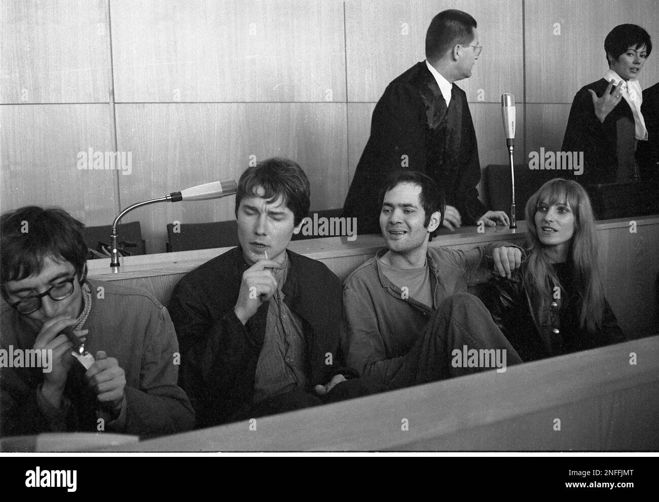 Horst Soehnlein lights a big cigar as Thorwald Proll, Andreas Baader ...