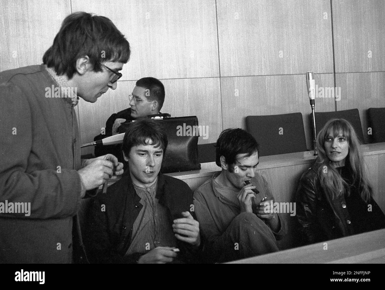 Horst Soehnlein, left, and Andreas Baader light a big cigar as Thorwald ...