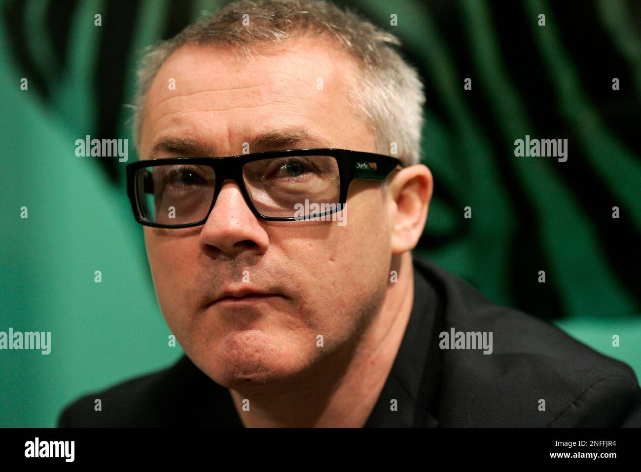 British artist Damien Hirst poses at an auction house in London, Monday ...