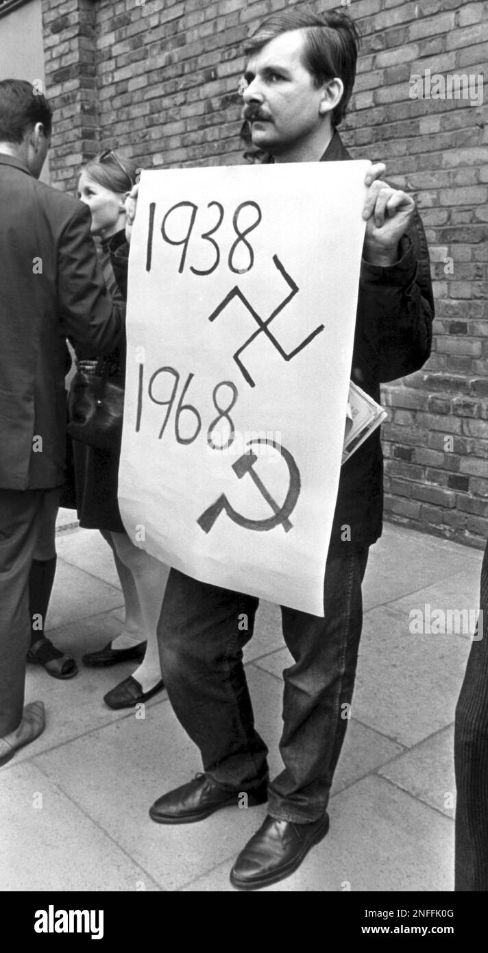 Protesting the Soviet bloc invasion of Czechoslovakia, a demonstrator ...
