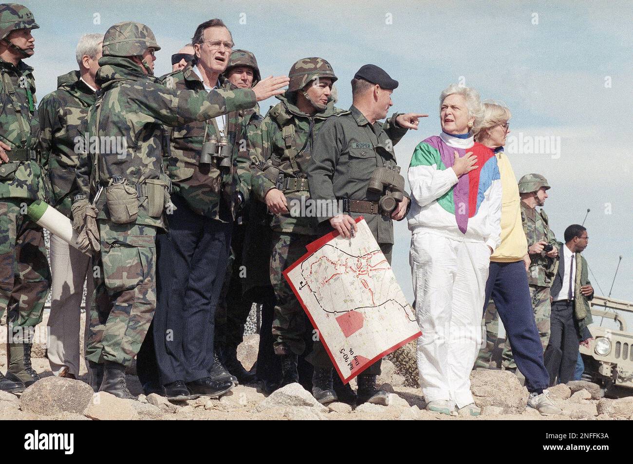 President George H.W. Bush and his wife Barbara, watch military ...