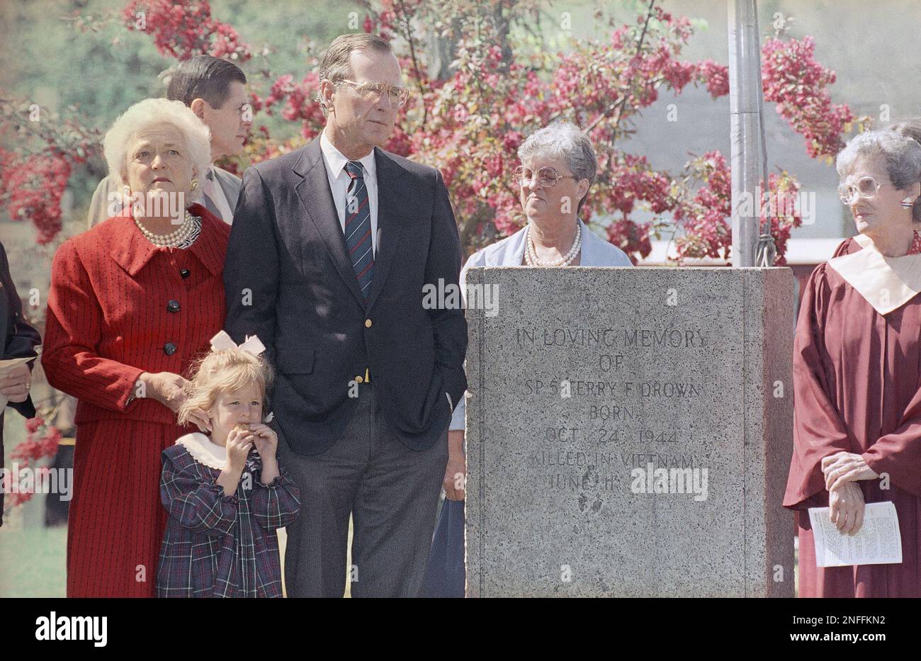 Pres. George H. W. Bush, center left, and First Lady Barbara Bush, left ...