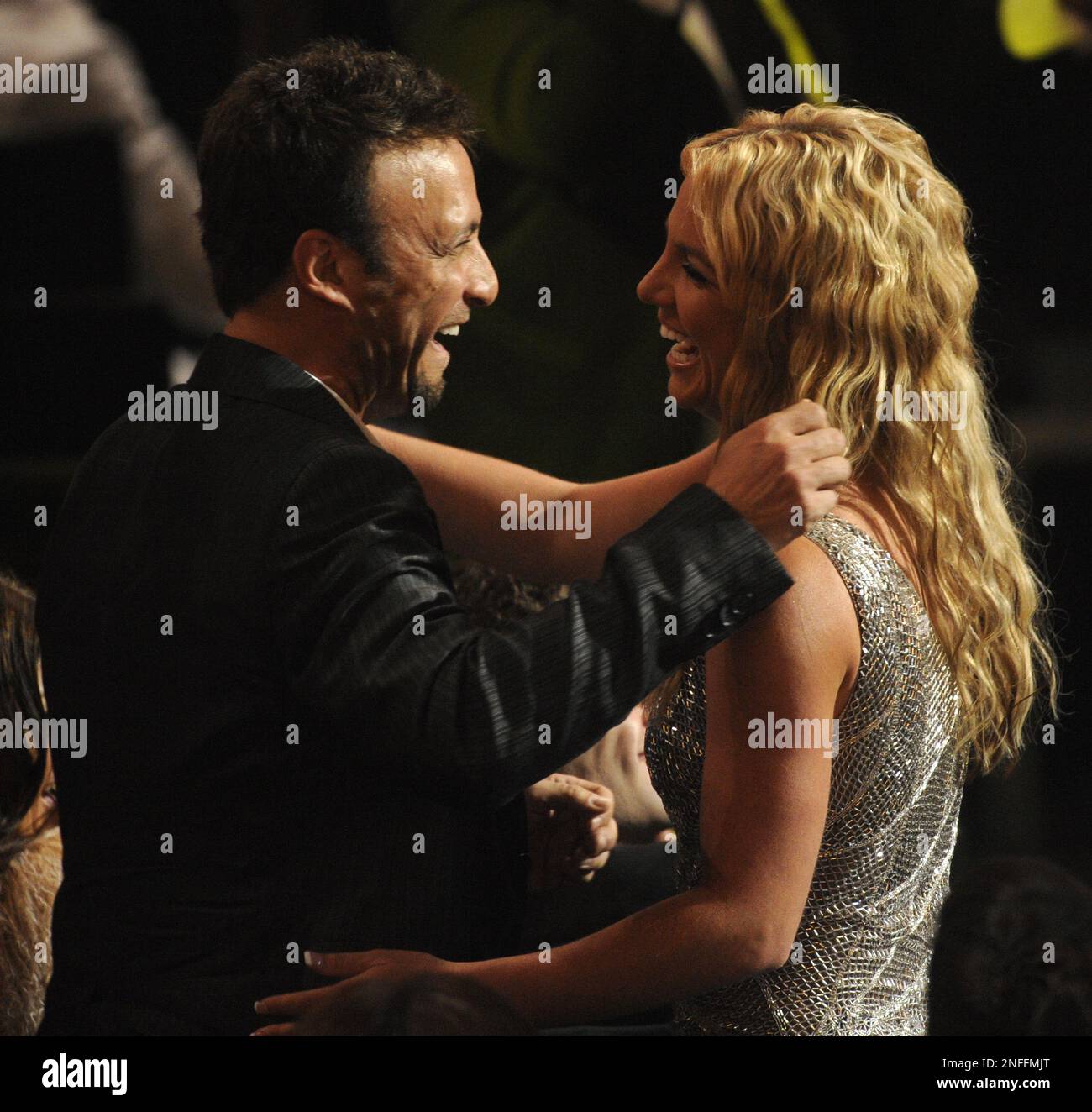 Britney Spears and her manager, Larry Rudolph hug after she wins one of ...