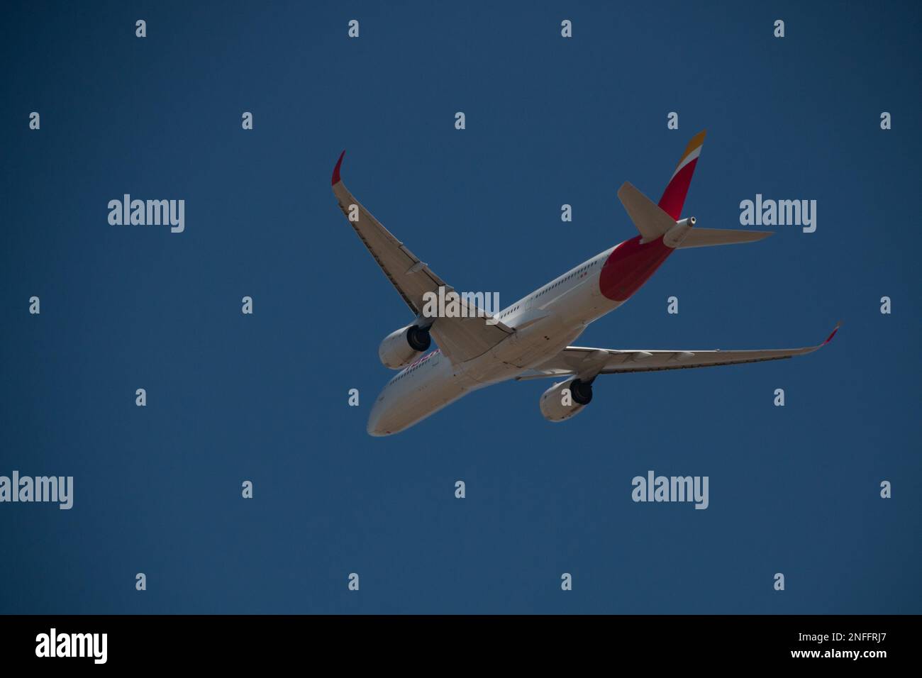 Plane ascending into the sky, flying, on its takeoff from the airport ...