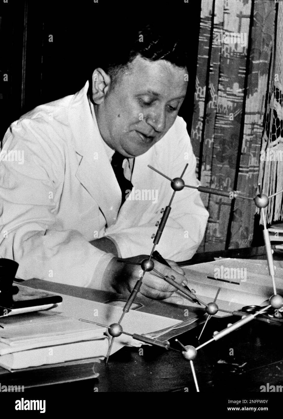 Professor Kurt Alder of Cologne, Germany, Nobel prize winner, is shown ...