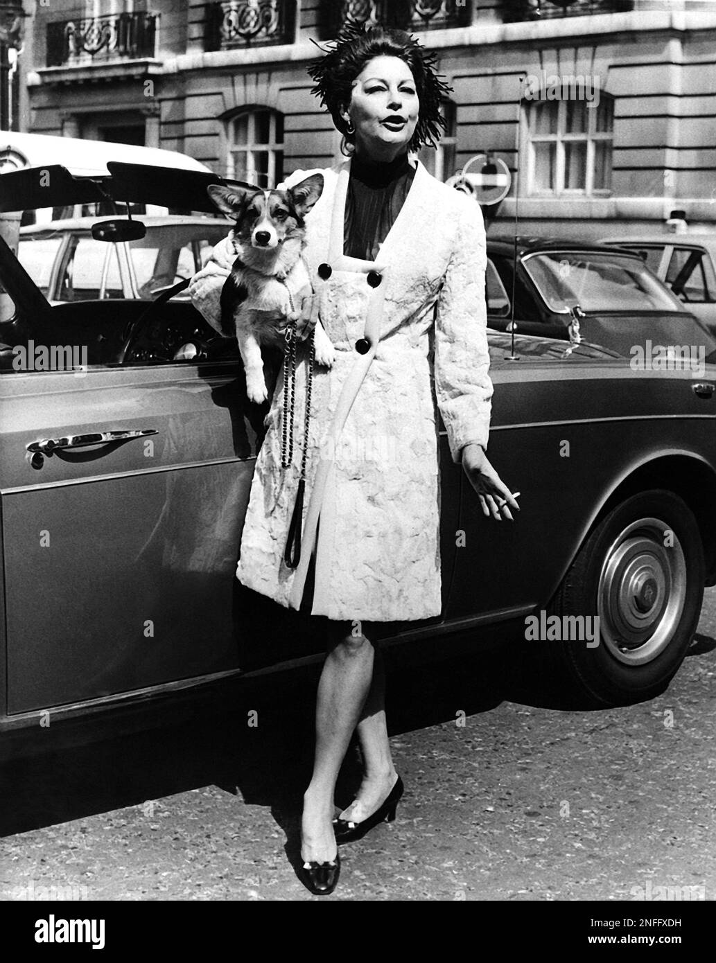 Actress Ava Gardner holds her Corgi Dog, "Cara" during the shooting of ...
