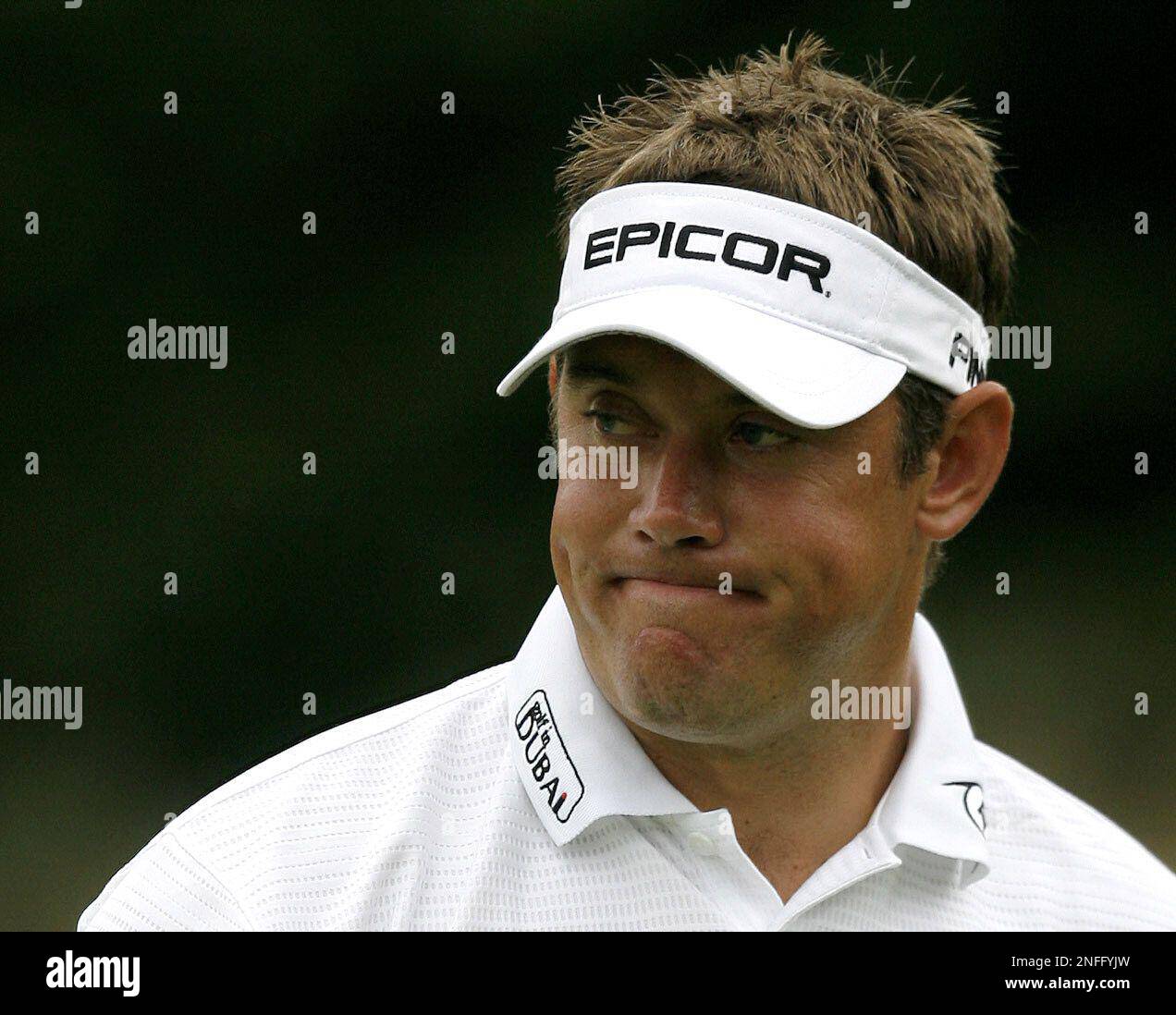 England's Lee Westwood reacts after getting a birdie on the 16th hole ...