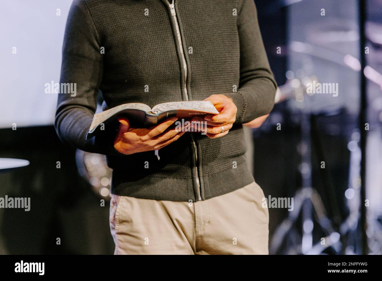 Pastor with a Bible in his hand during a sermon. The preacher delivers ...