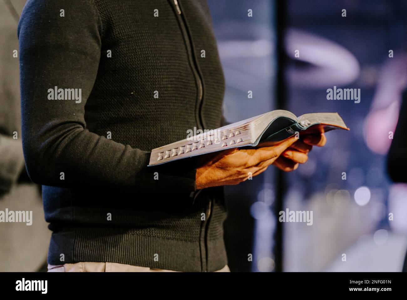 Pastor with a Bible in his hand during a sermon. The preacher delivers ...