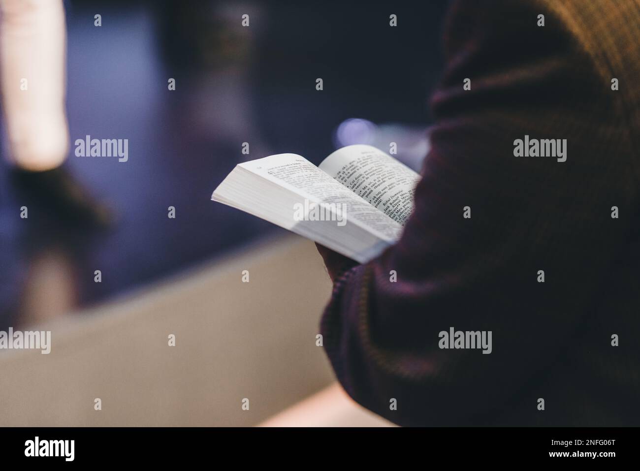 Pastor with a Bible in his hand during a sermon. The preacher delivers ...