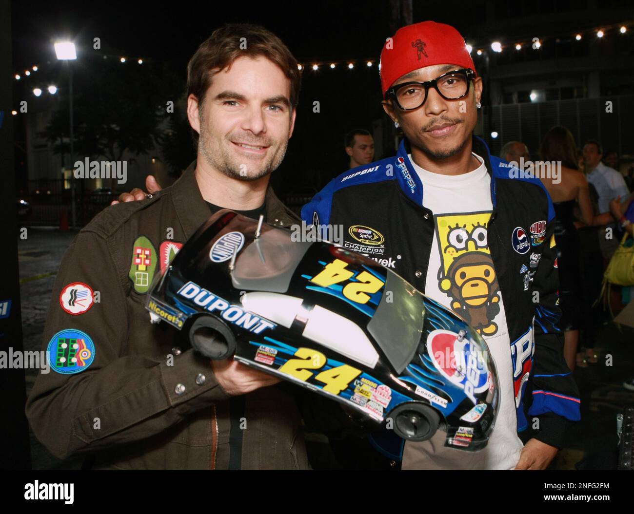 Jeff Gordon and Pharrell Williams at the Pepsi 500 Running Wide Open ...