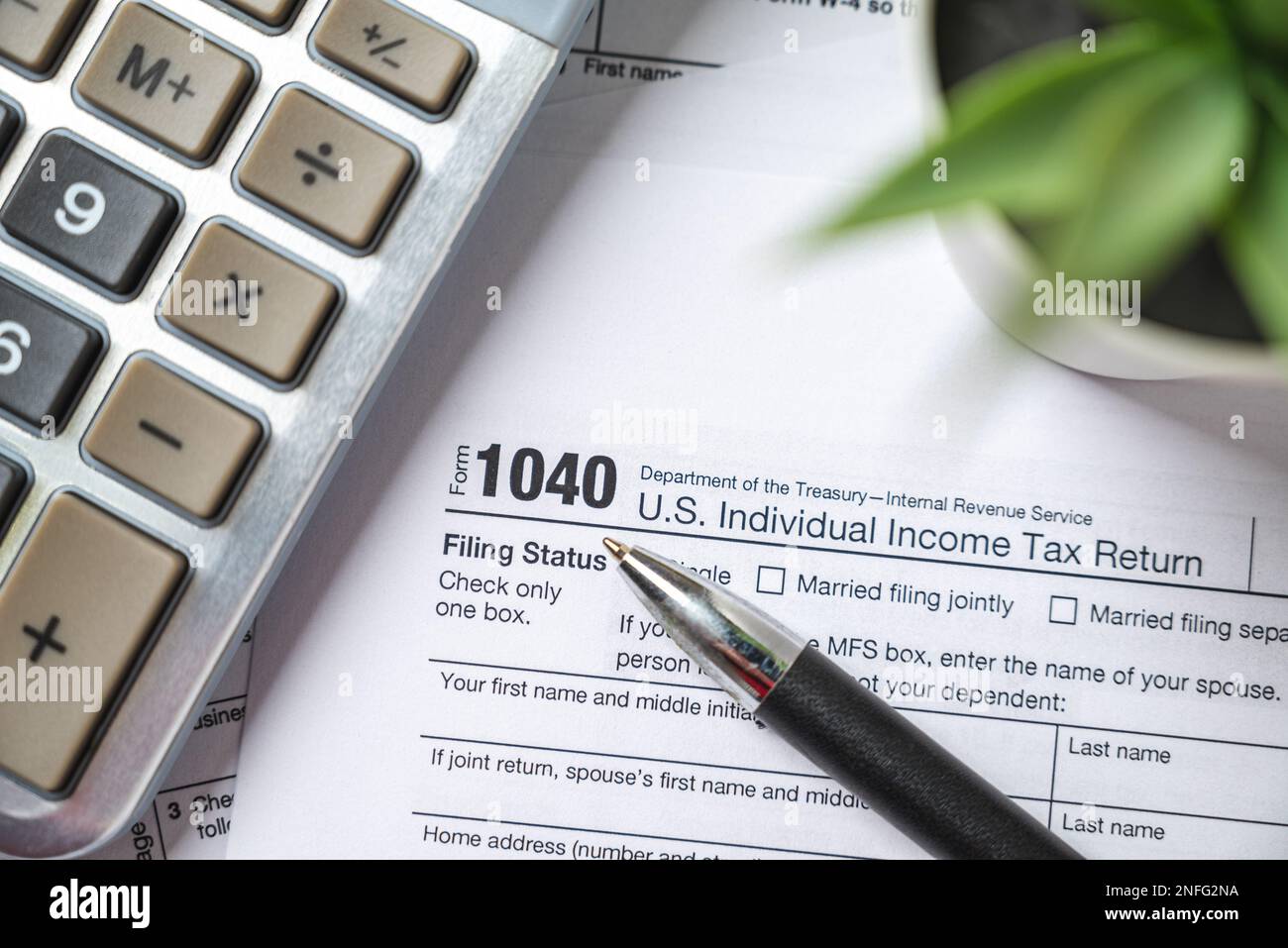 Financial time tax return forms with pen and calculator Stock Photo - Alamy