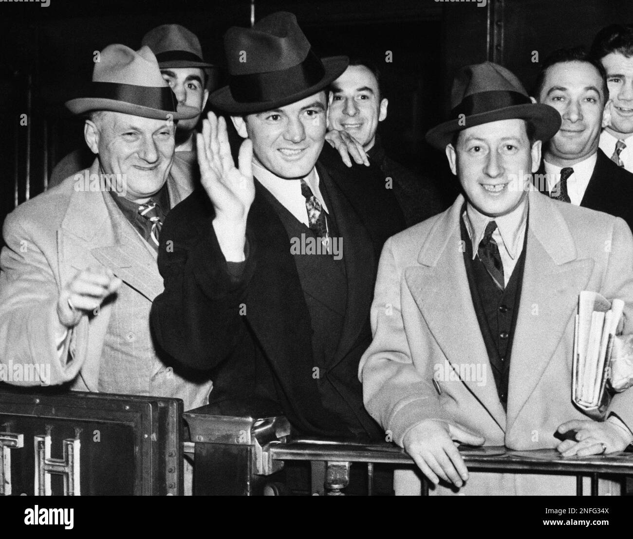 Jim Braddock, center, Joe Gould, his manager, right, and Mike Jacobs ...