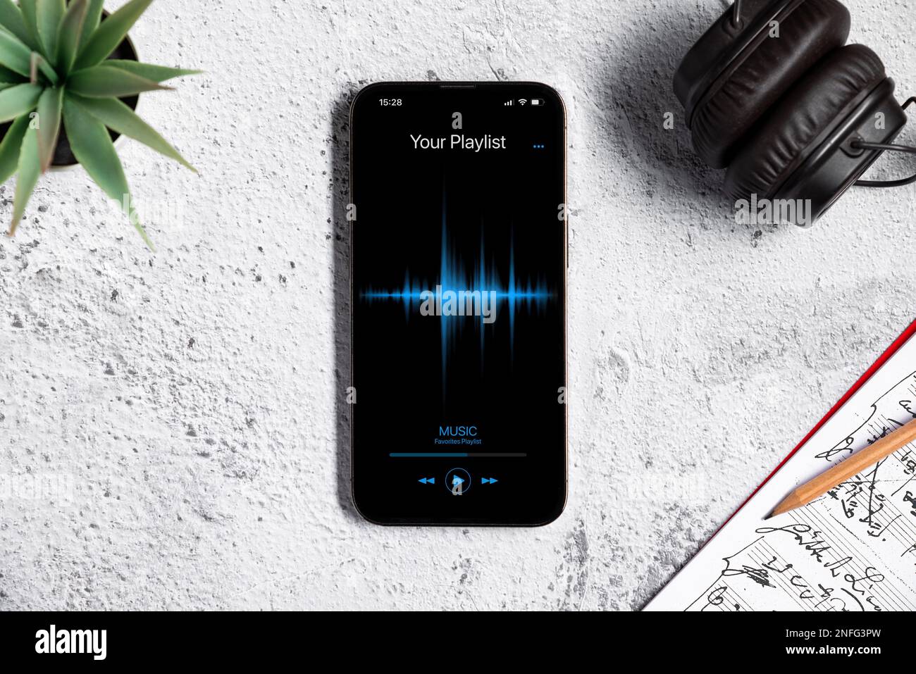 Top view of smartphone with music player app on white stone office ...