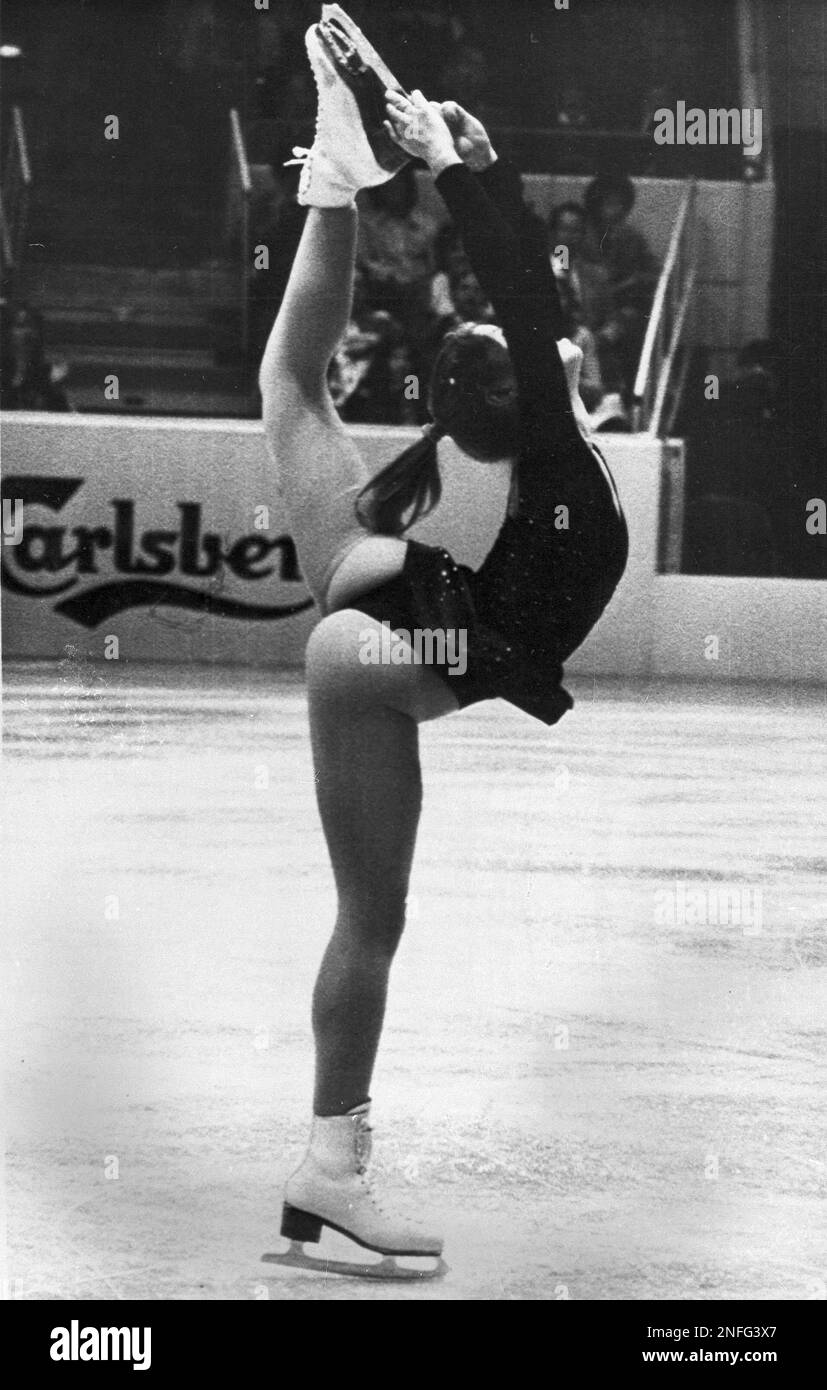 Denise Biellmann of Switzerland raises one leg above her head as she ...