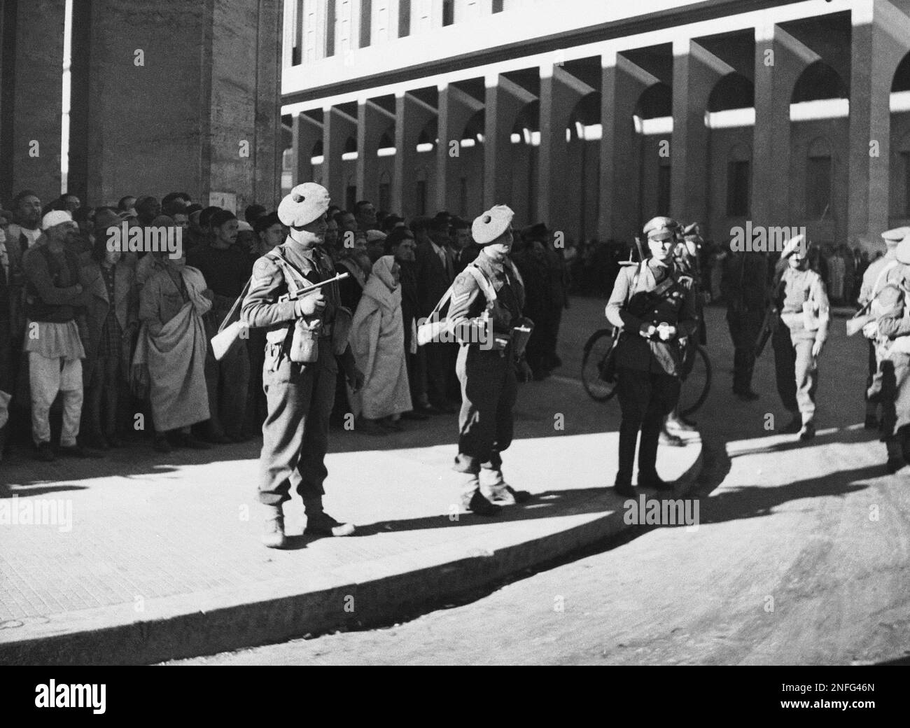 British Soldiers (wearing teams) and Italian police (with visored caps ...