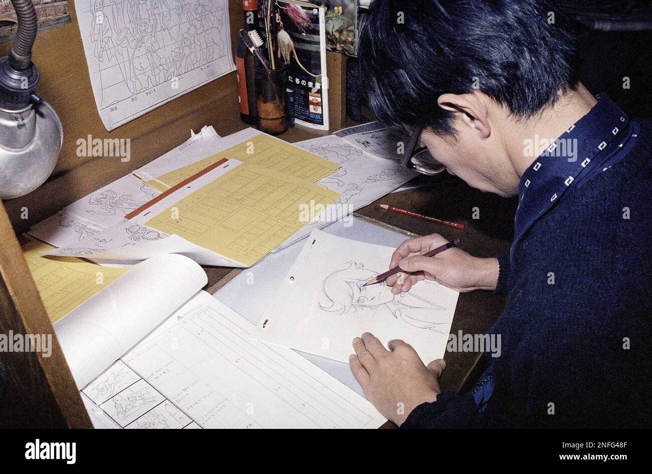 An Unidentified student working on a drawing at Toei Animation School ...