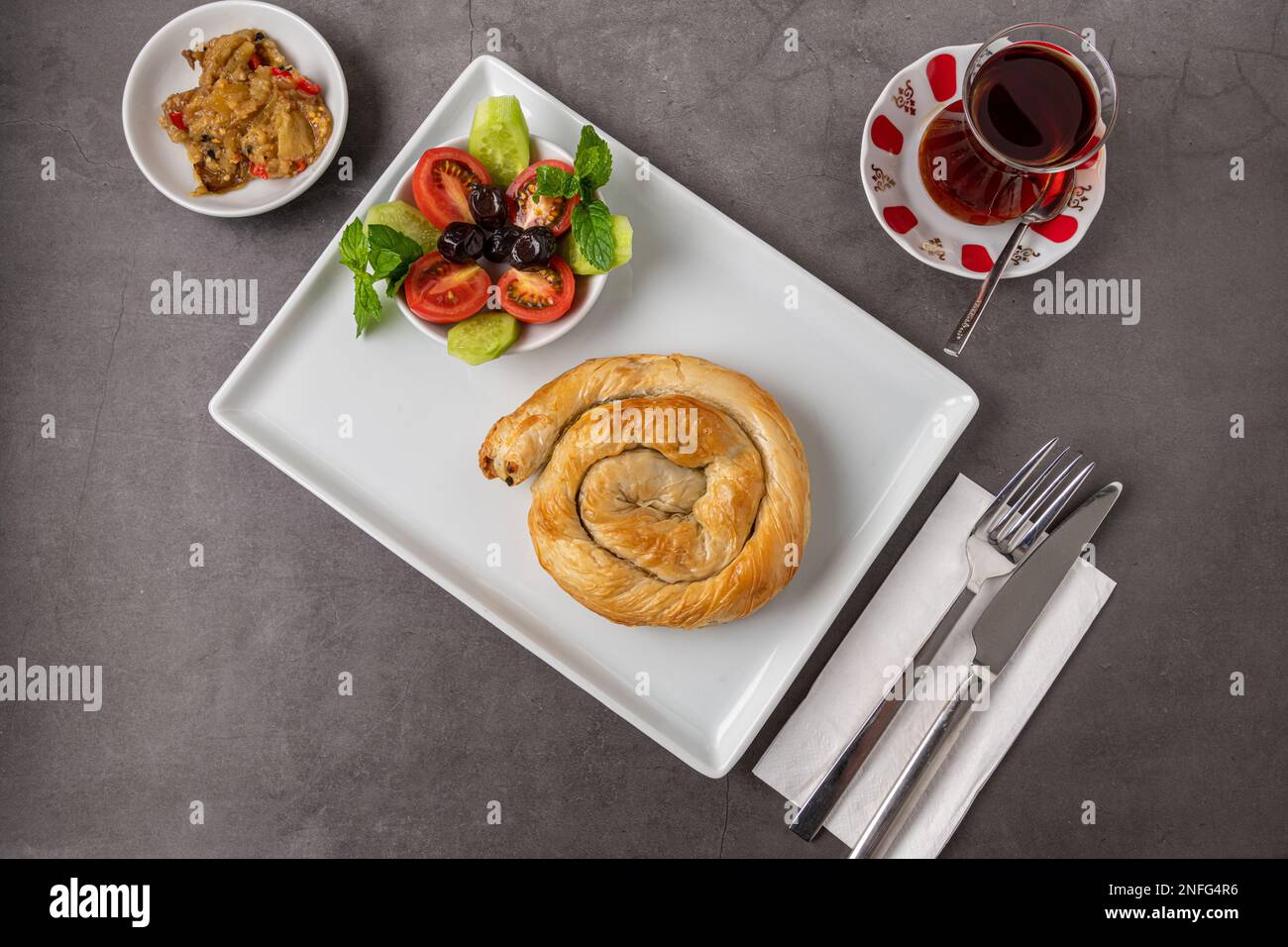 Traditional Turkish pastry made with spinach and cheese wrapped in ...