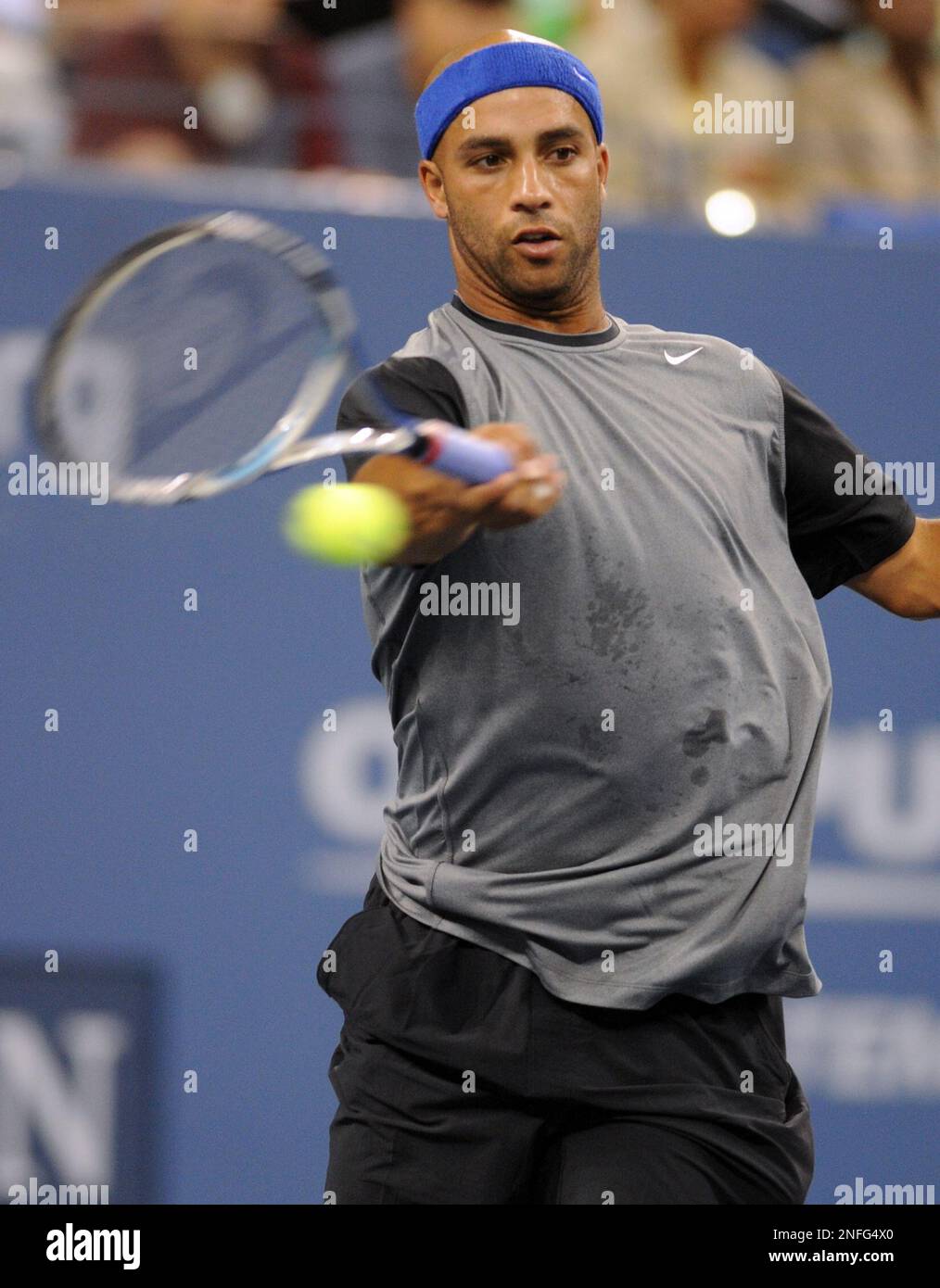 James Blake, of the United States, hits a forehand during his opening ...