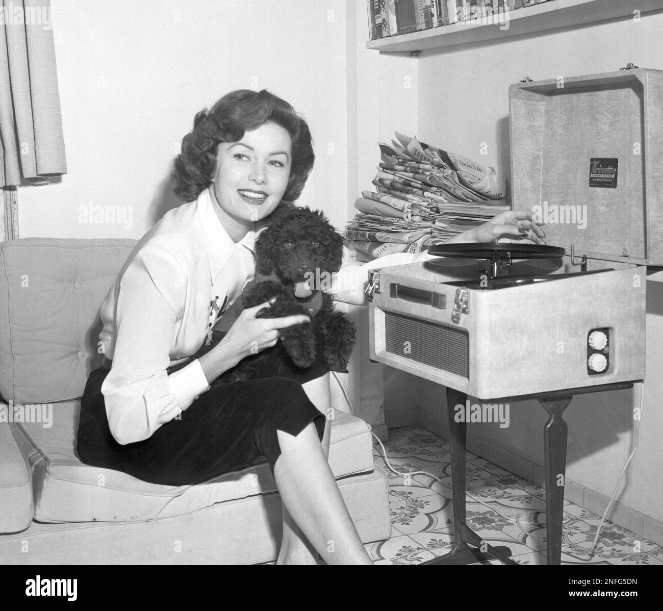 Lovely Rhonda Fleming of Hollywood reading in her penthouse apartment ...