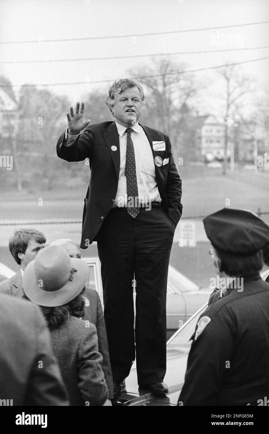 Sen. Edward Kennedy, D-Mass., used the hood of a car to speak from ...