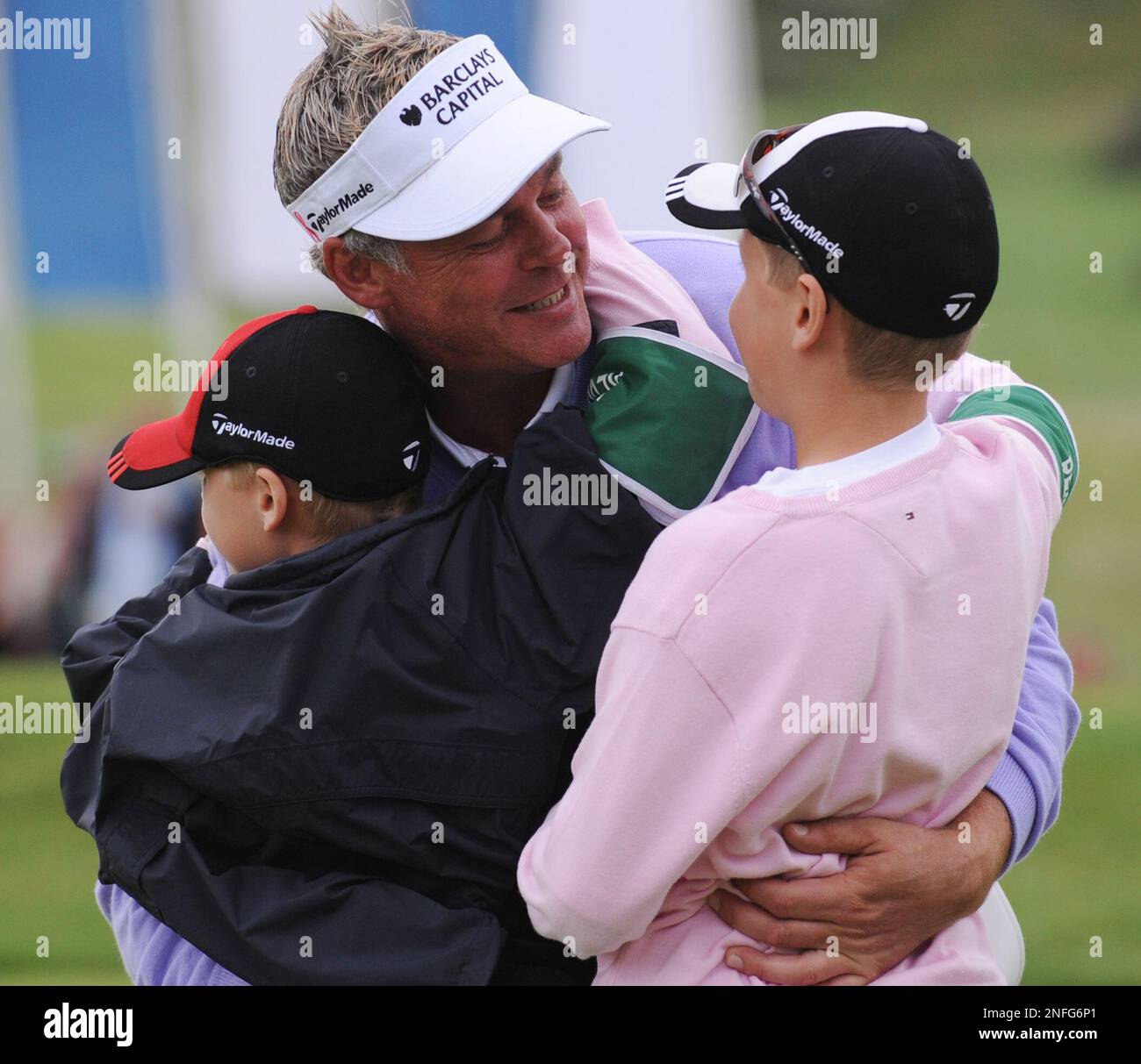 Darren Clarke poses with his sons Conner and Tyrone, after winning the ...