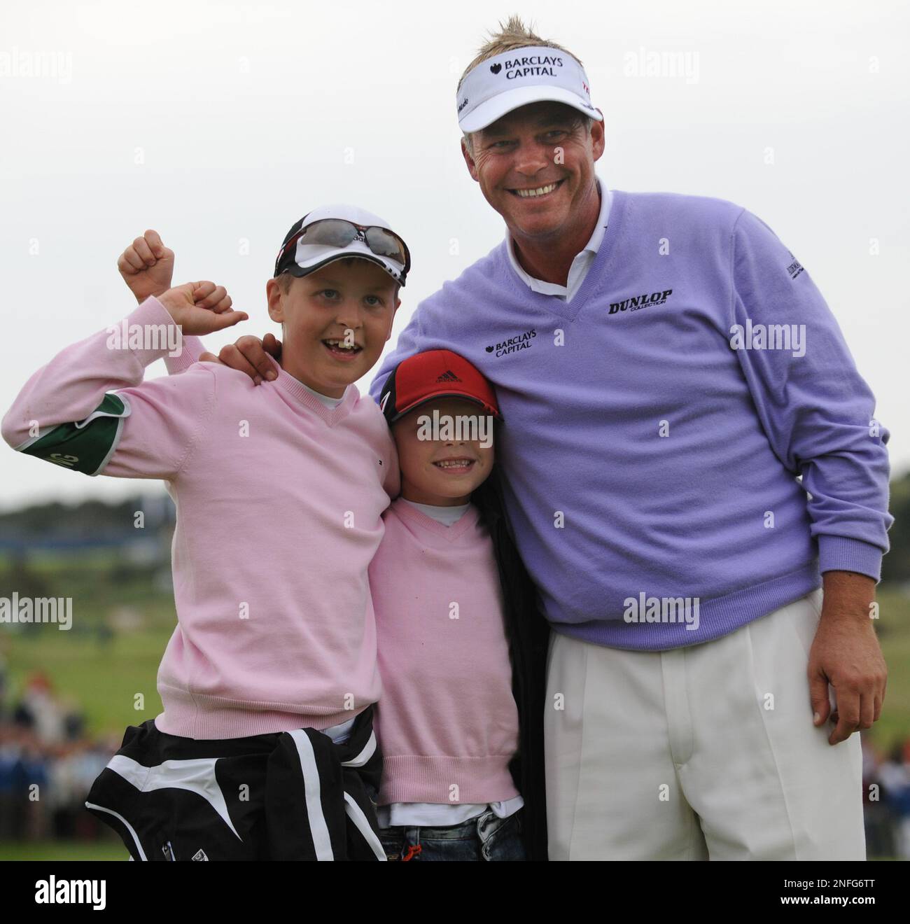 Clarke Darren poses with his sons Connor left, and Tyrone, after ...
