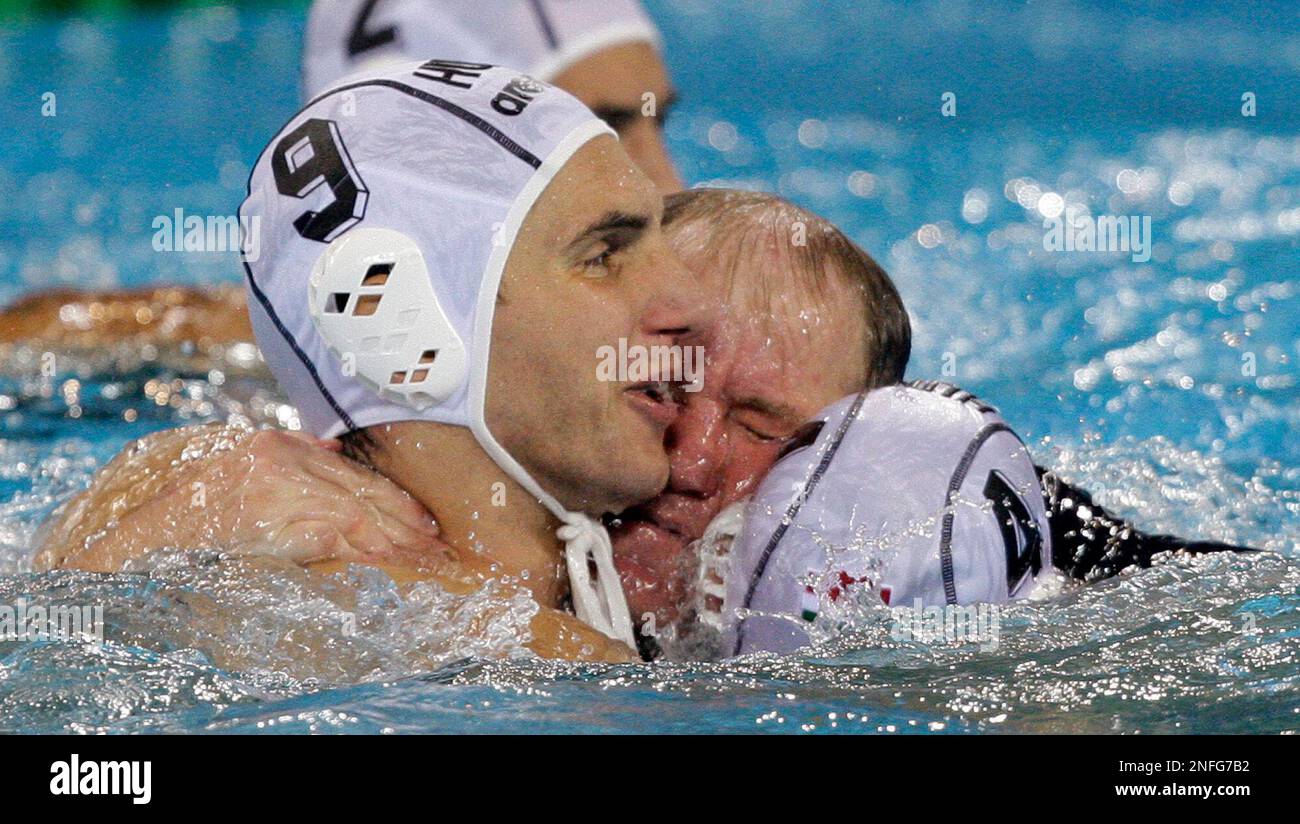 Hungary head coach Denes Kemeny hugs Daniel Rudolf Varga (9) and Denes ...