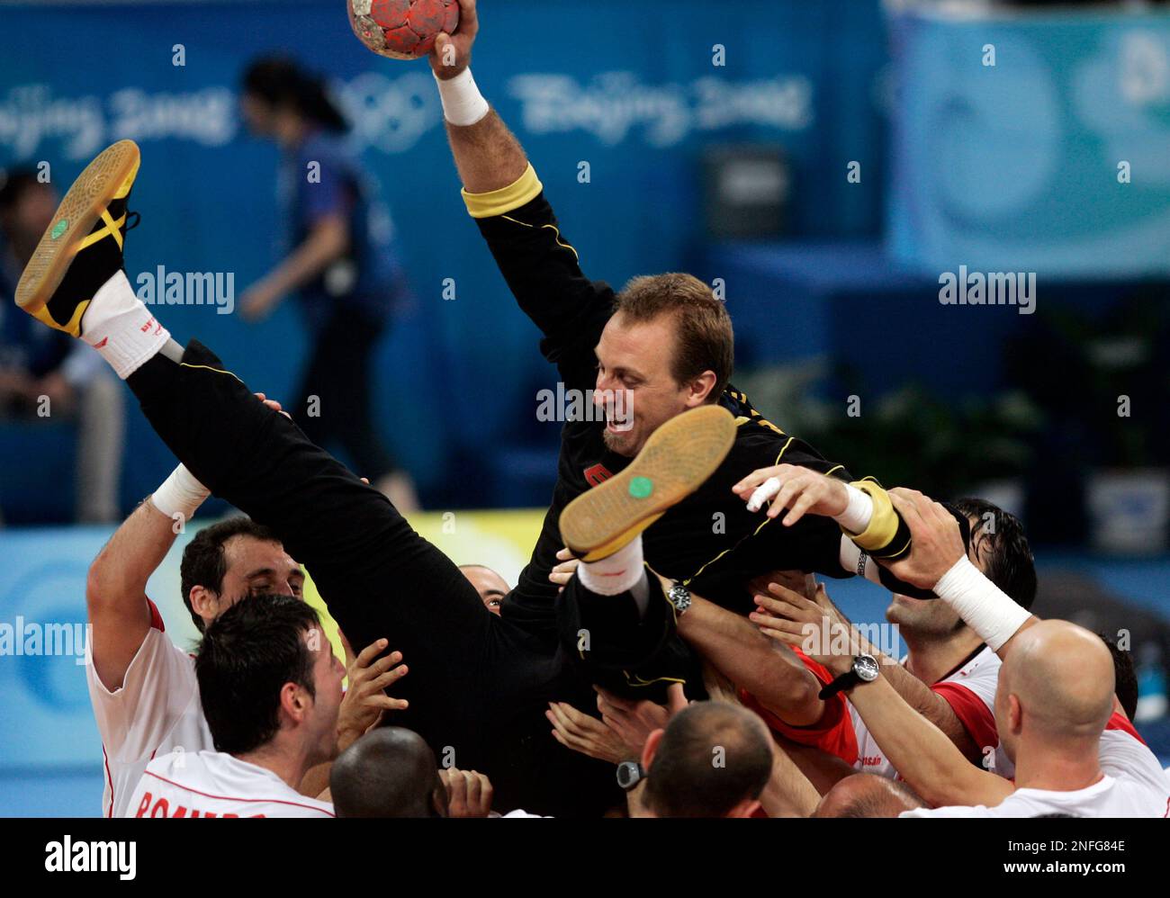 Spain's goalkeeper David Barrufet is tossed in the air after defeating ...