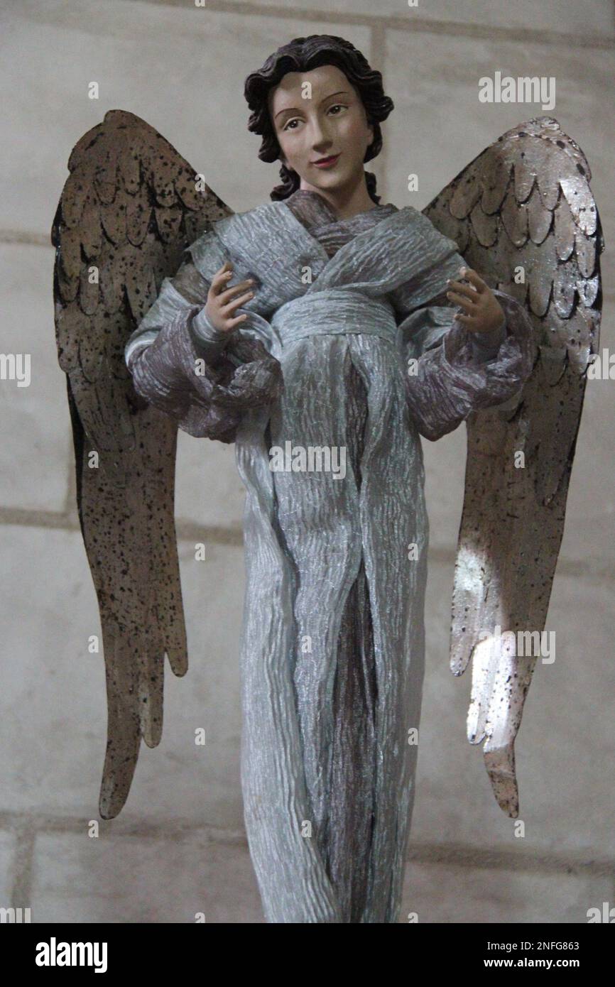 statue of an angel in a church in saché (france Stock Photo - Alamy