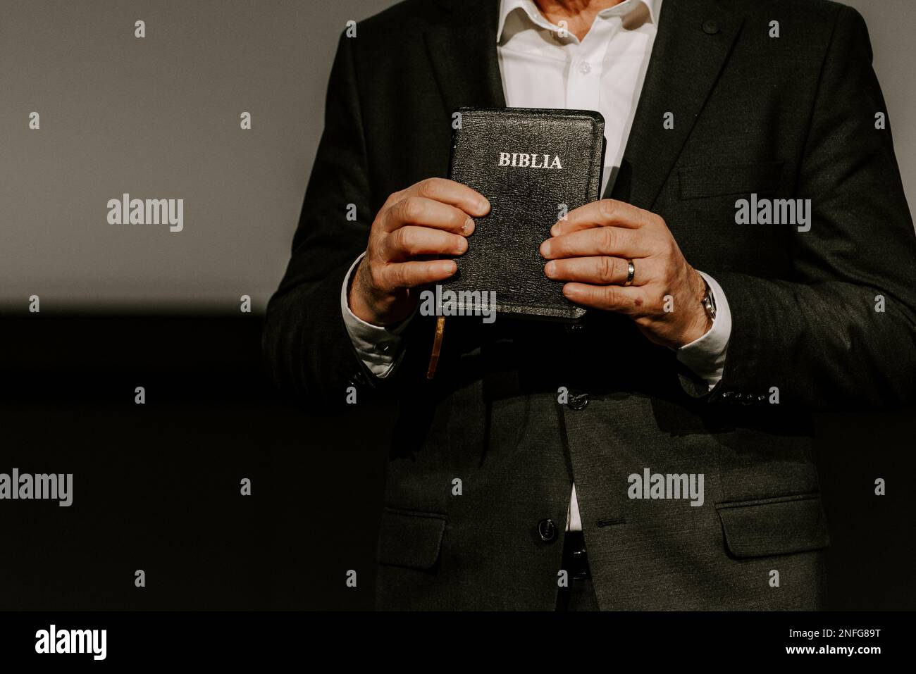 Pastor with a Bible in his hand during a sermon. The preacher delivers ...