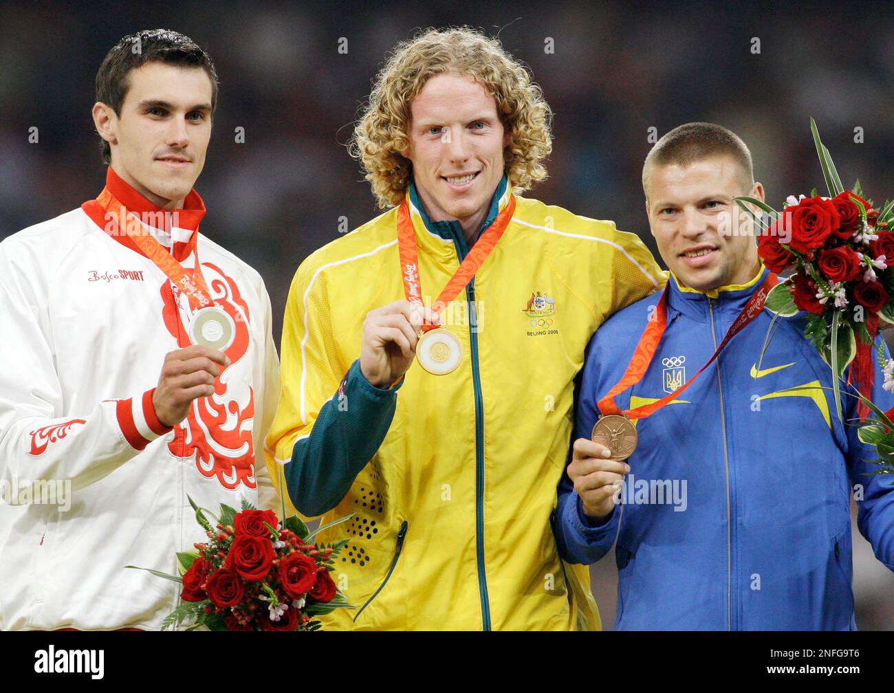Men's pole vault gold medalist Australia's Steve Hooker, center, silver ...