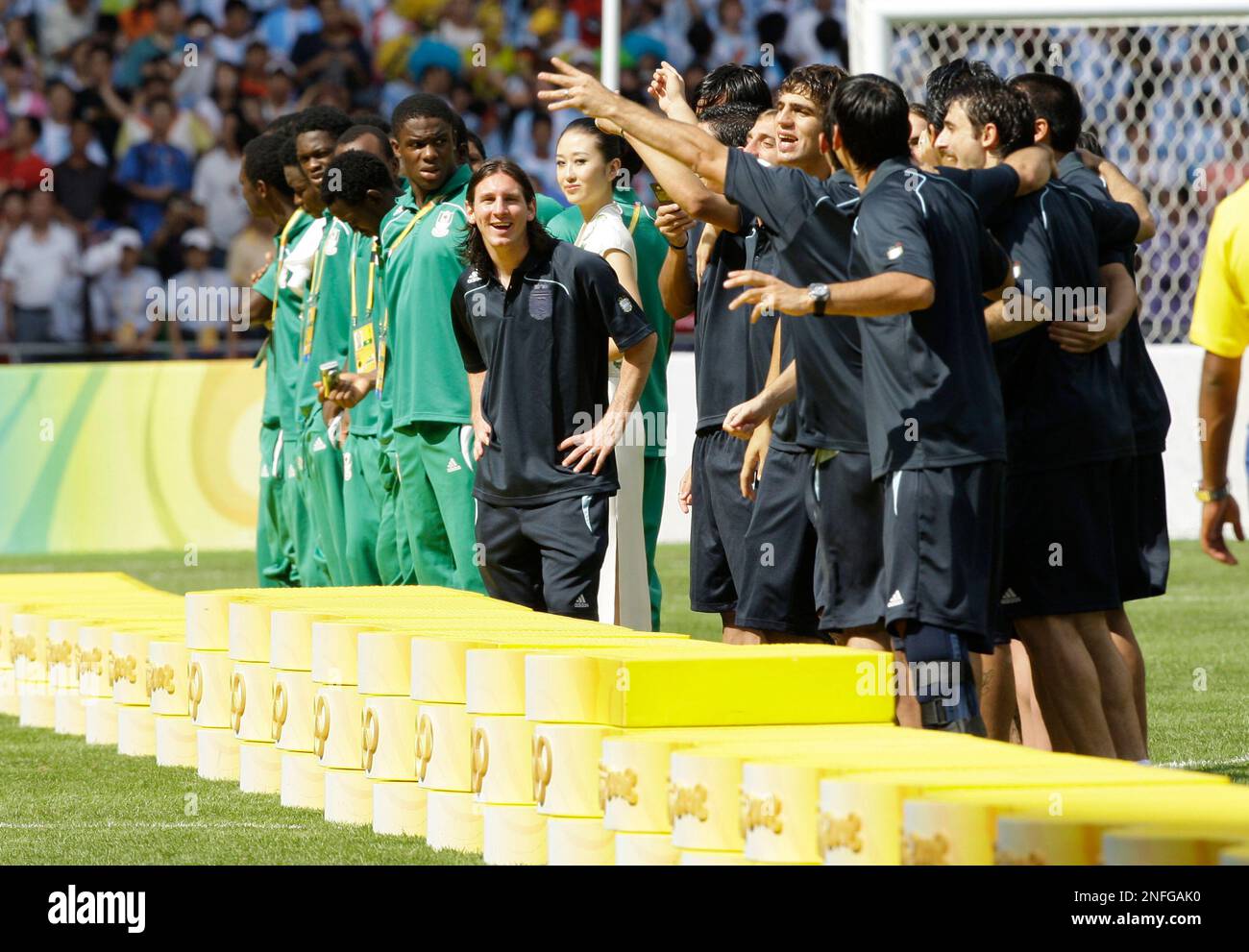 Argentina's Lionel Messi, center, smiles during the medal ceremony ...